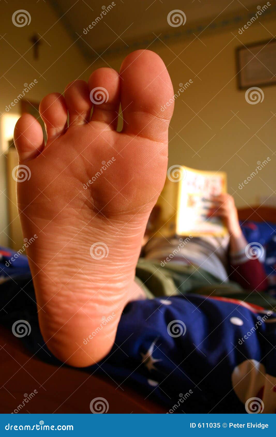 Relaxing with a book stock image. Image of reading, foot - 611035