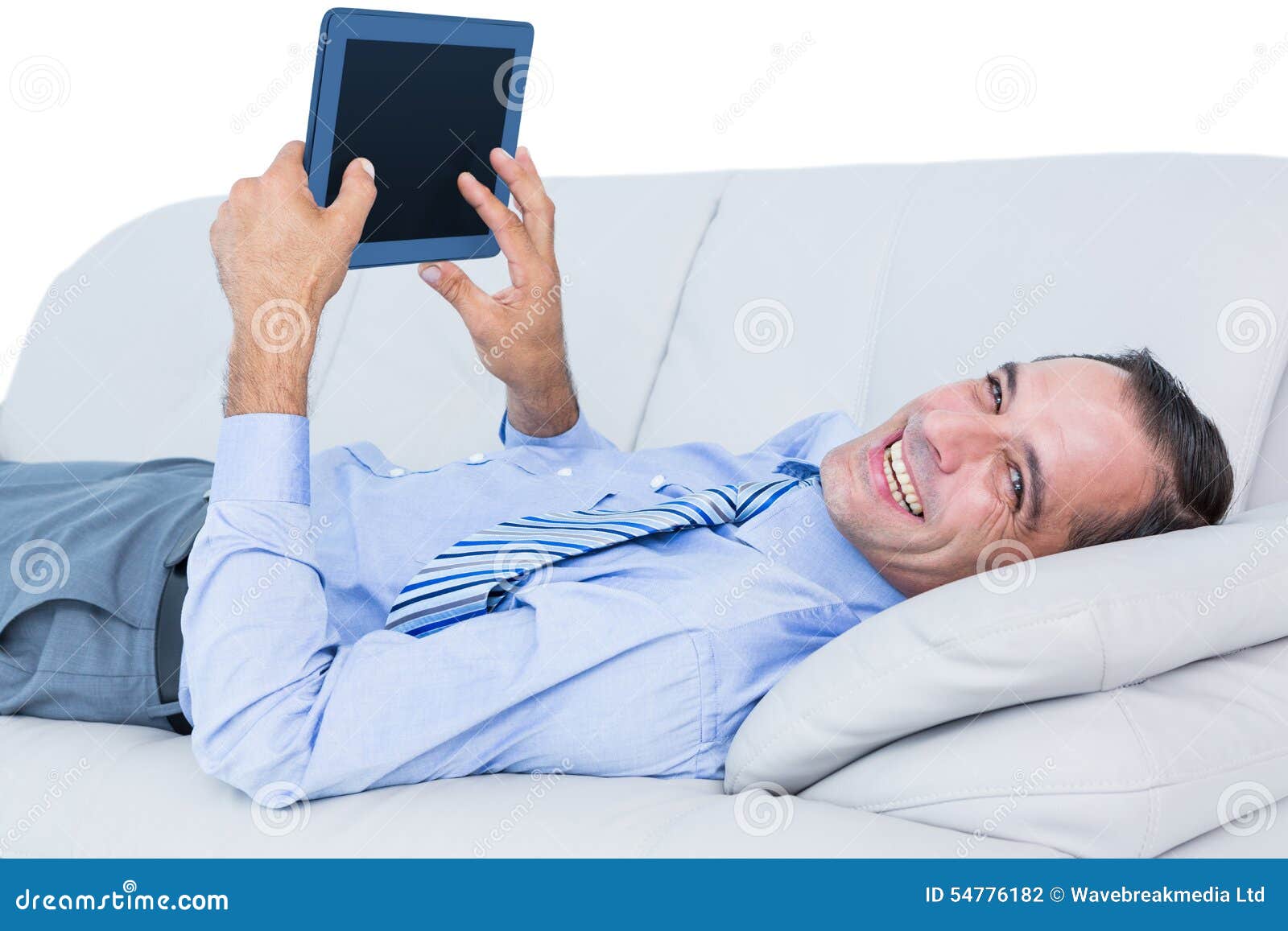 Relaxing Businessman on a Sofa with a Tablet Stock Photo - Image of ...