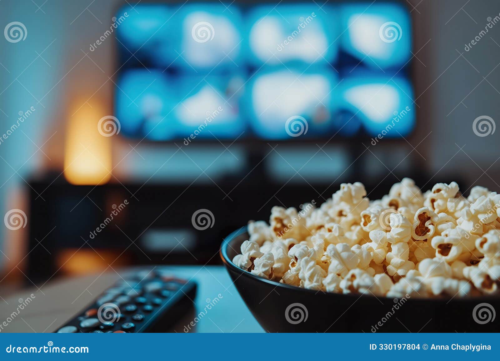 Relaxing Evening with Popcorn and Remote Control in Front of the TV ...
