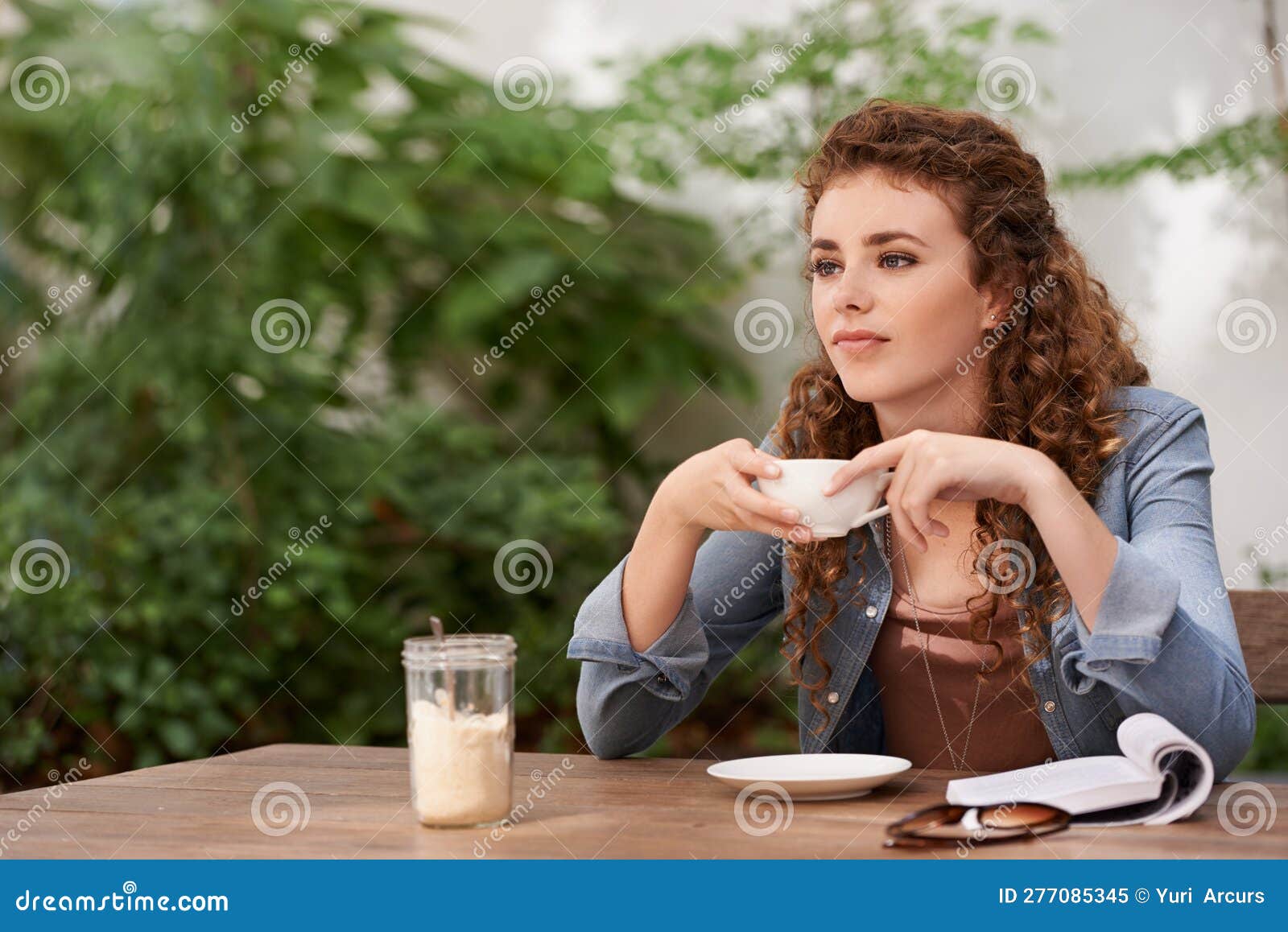Relaxing with a Fresh Cup of Coffee. a Young Woman Drinking Coffee at a ...