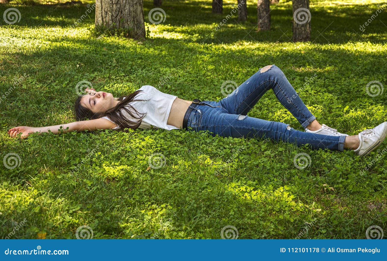 Relaxing Girl Lying on the Grass. Stock Photo - Image of fresh ... Relaxing Girl Lying on the Grass. Stock Photo - Image of fresh ...