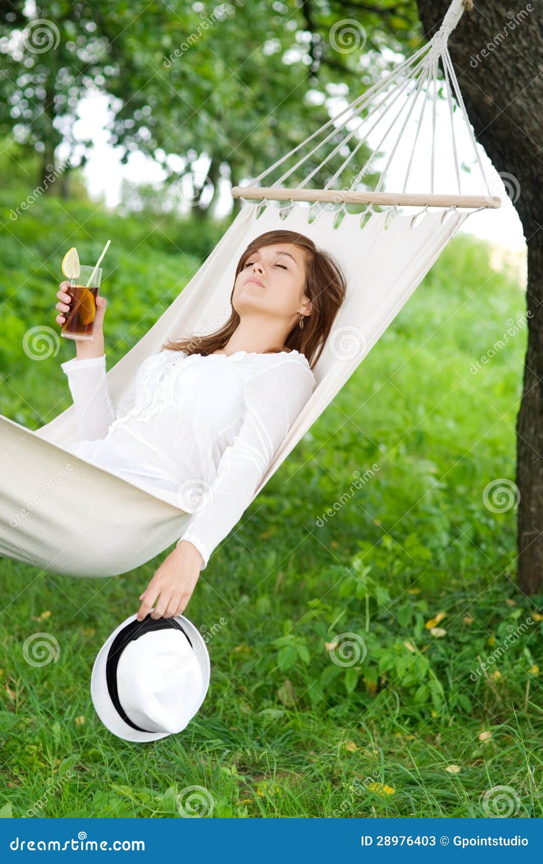 Relaxing on hammock stock image. Image of drinking, back - 28976403