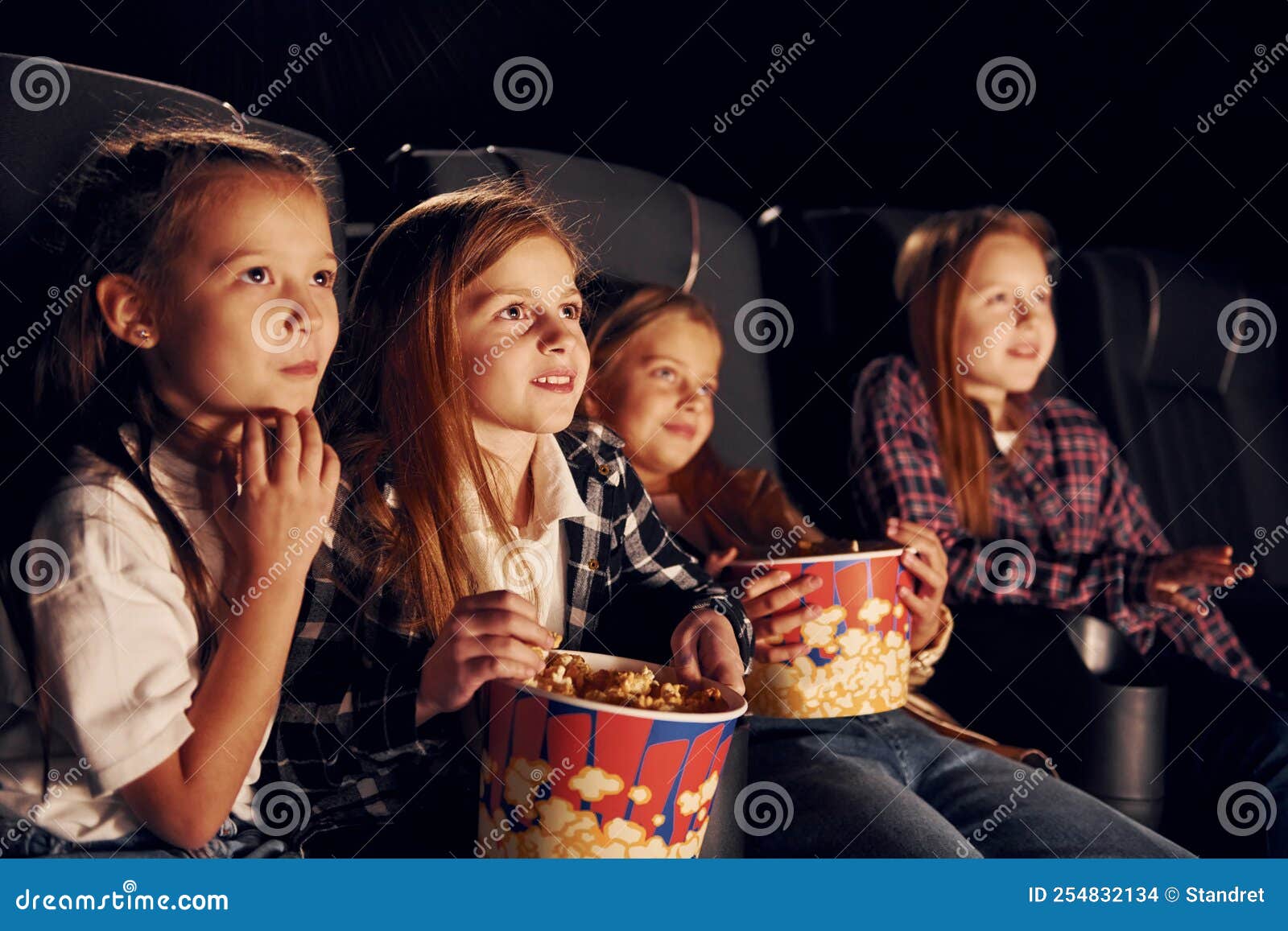 Relaxing and Having Fun. Group of Kids Sitting in Cinema and Watching ... Relaxing and Having Fun. Group of Kids Sitting in Cinema and Watching ...