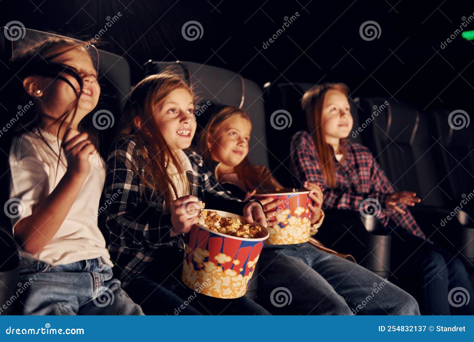 Relaxing and Having Fun. Group of Kids Sitting in Cinema and Watching ... Relaxing and Having Fun. Group of Kids Sitting in Cinema and Watching ...