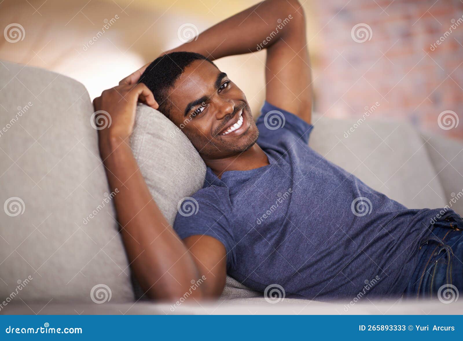 Relaxing on His Day Off. a Handsome Young Man Relaxing at Home. Stock ...