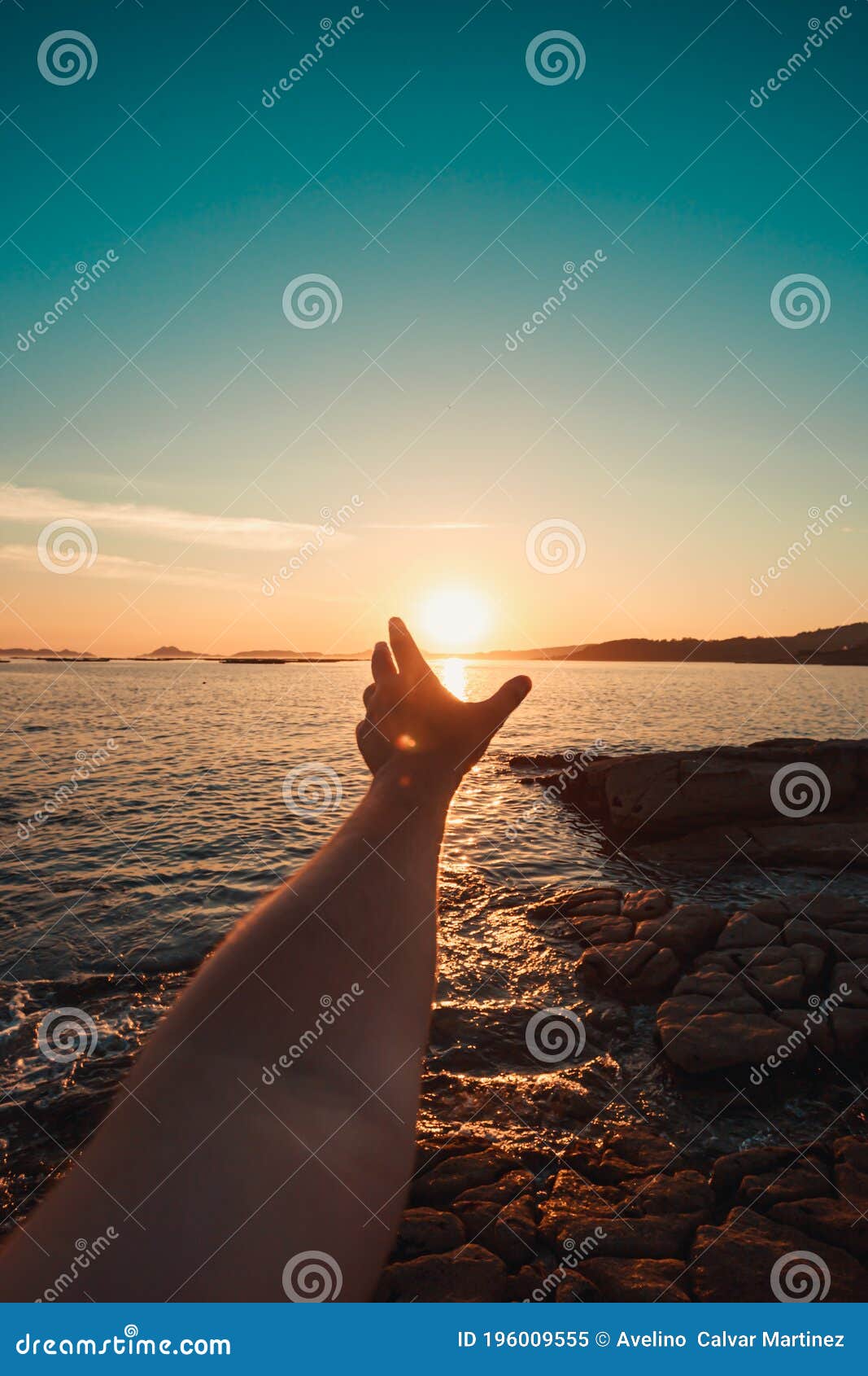 Relaxing Image of a Male Hand in Front of a Massive Sunset in the ...
