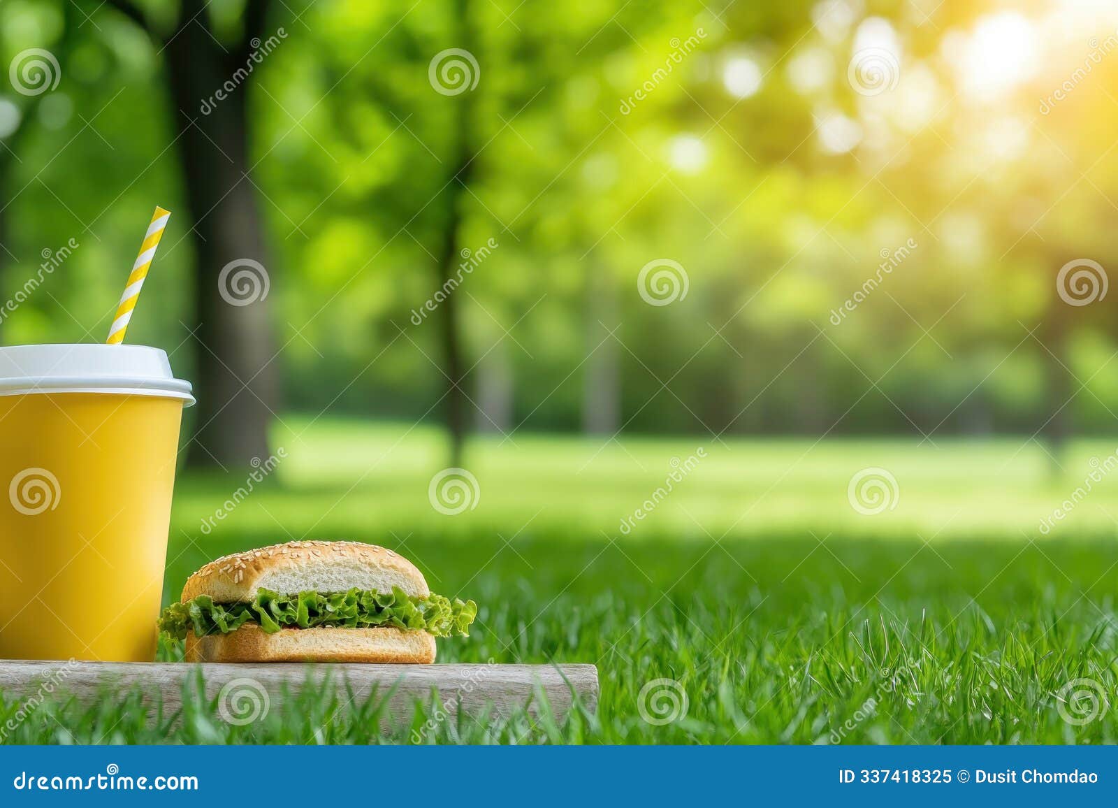 Relaxing Lunch Break Scene in Park with Sandwich and Drink Stock Image ...