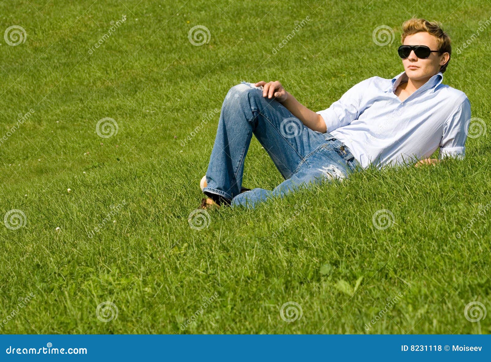 Relaxing man on grass stock photo. Image of nature, model - 8231118