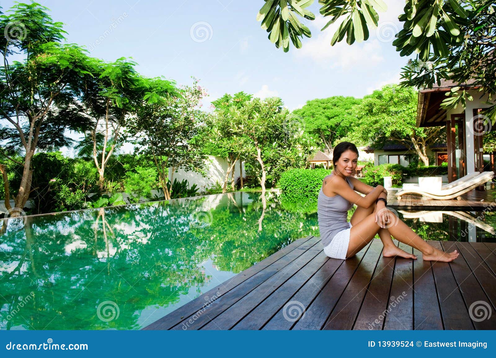 Relaxing by Pool stock photo. Image of individual, sitting - 13939524