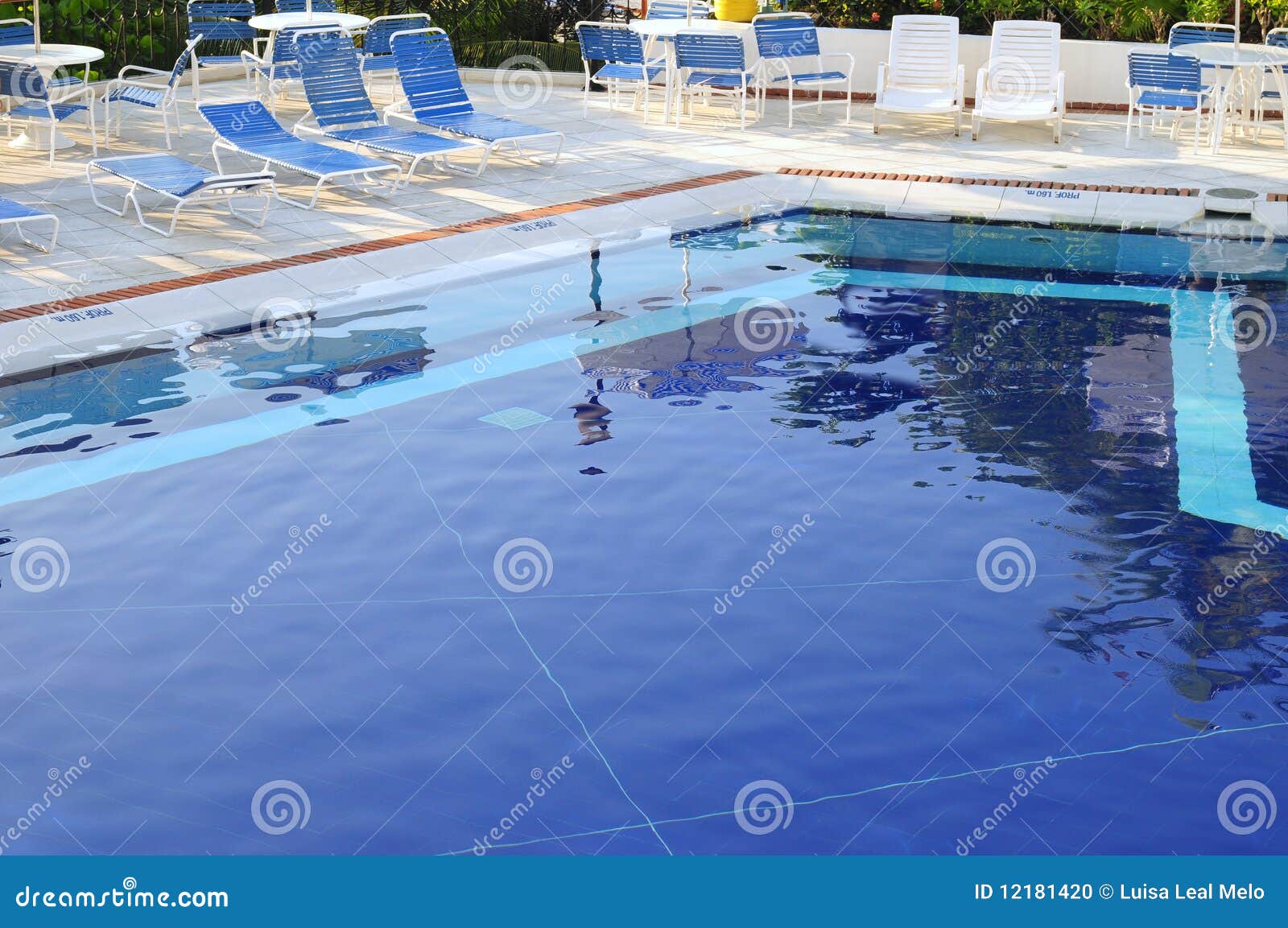 Relaxing pool area stock photo. Image of affluence, relaxation - 12181420