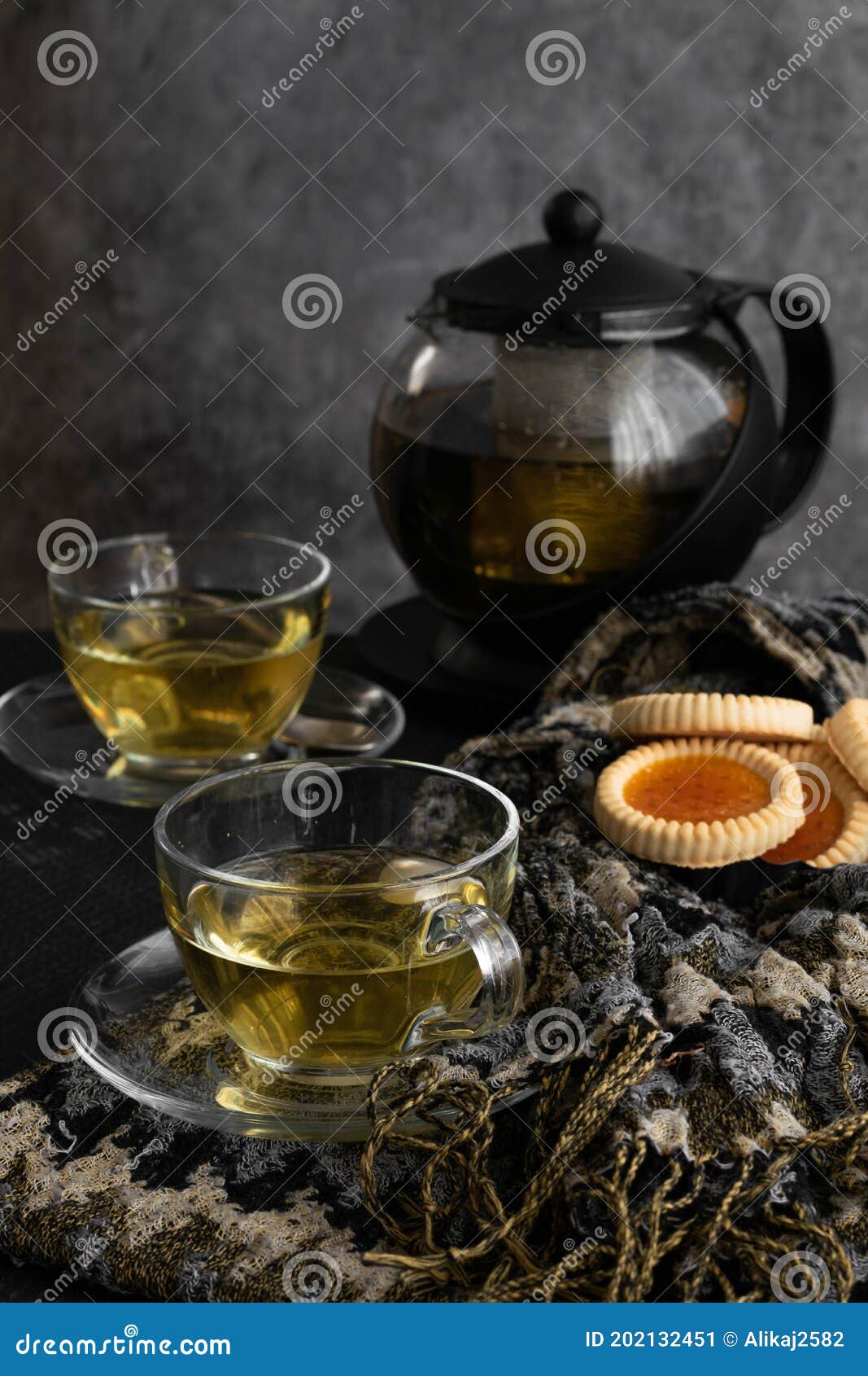 Relaxing Tea Time Concept. Dark Mood View of Herbal Tea and Cookies ...