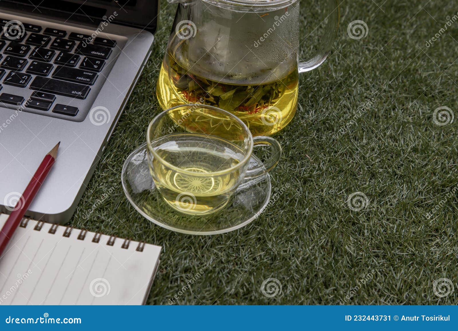 Relaxing Time with a Cup of Tea. Workplace Area with Laptop, Tea Cup ...