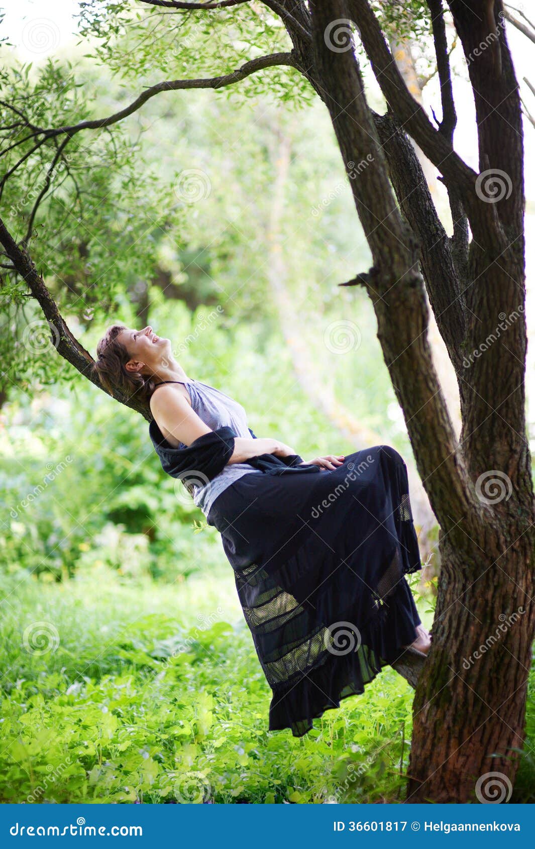 Relaxing on a tree stock image. Image of tree, girl, grass - 36601817