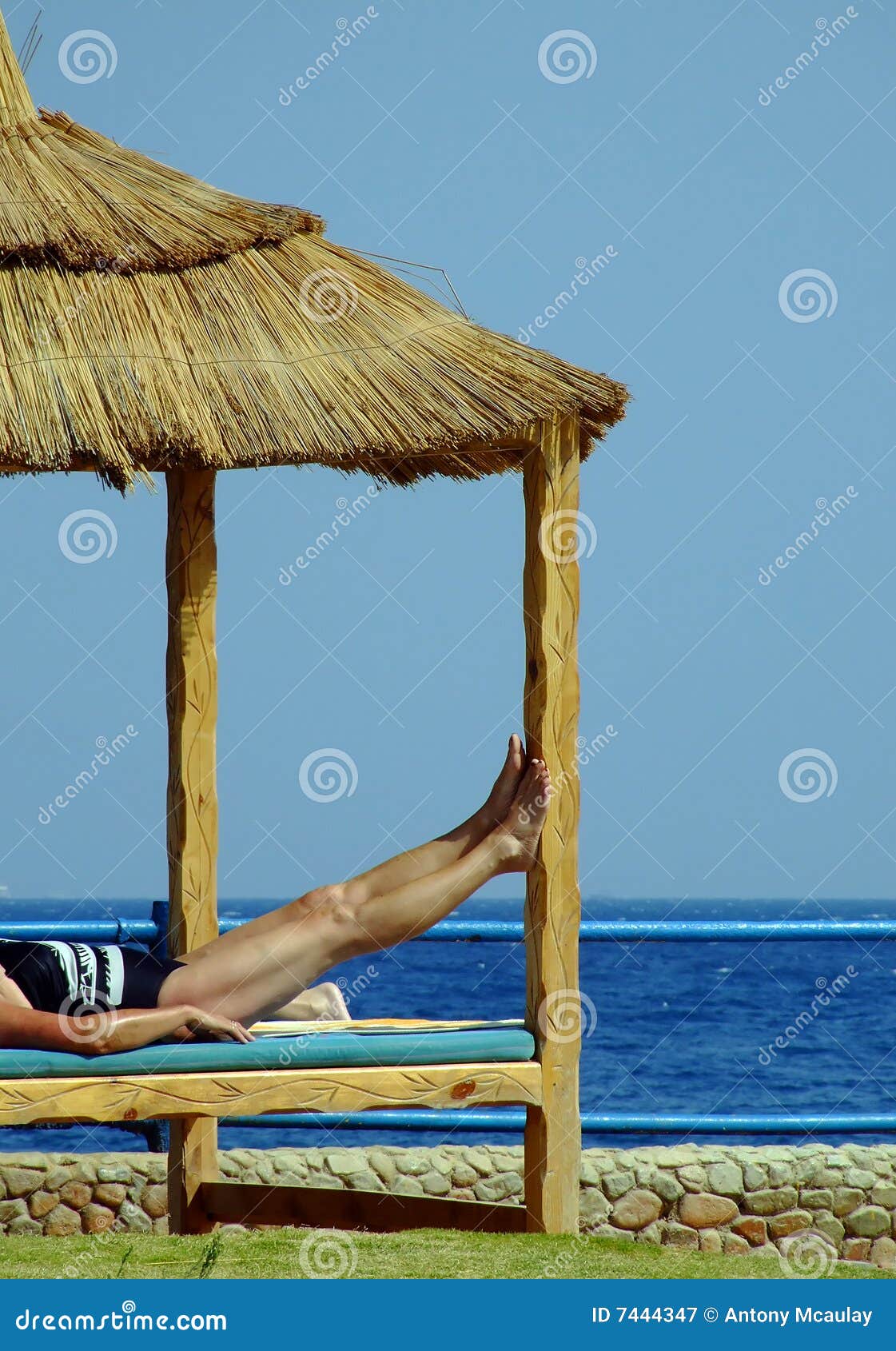 Relaxing vacation 02 stock image. Image of woman, parasol - 7444347