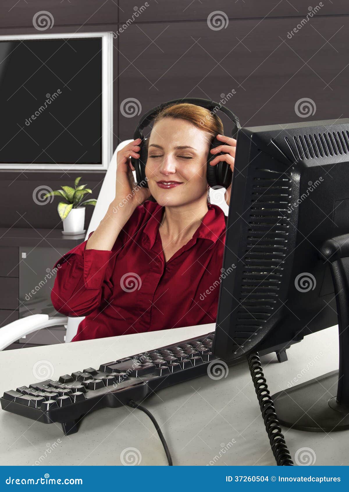 Relaxing at Work stock photo. Image of listen, desk, businesswoman ...
