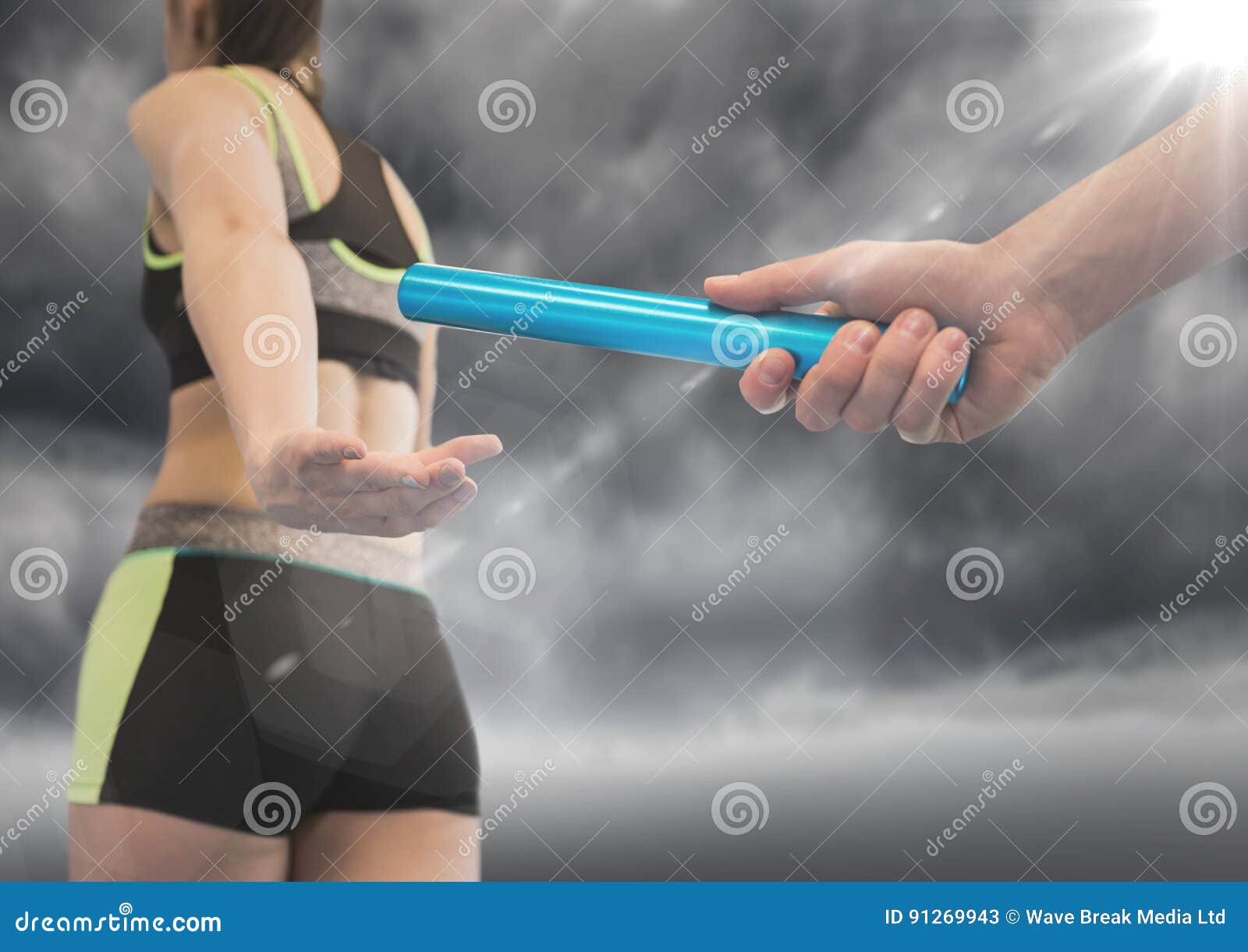 Relay Runner and Hand with Blue Baton and Flare Against Stormy Sky ...