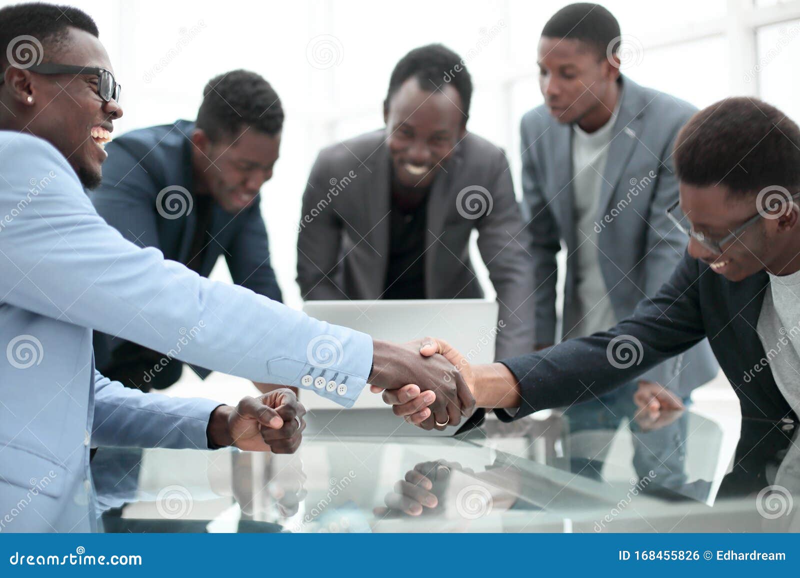Reliable Handshake of Business Partners Over the Desktop. Stock Photo ...