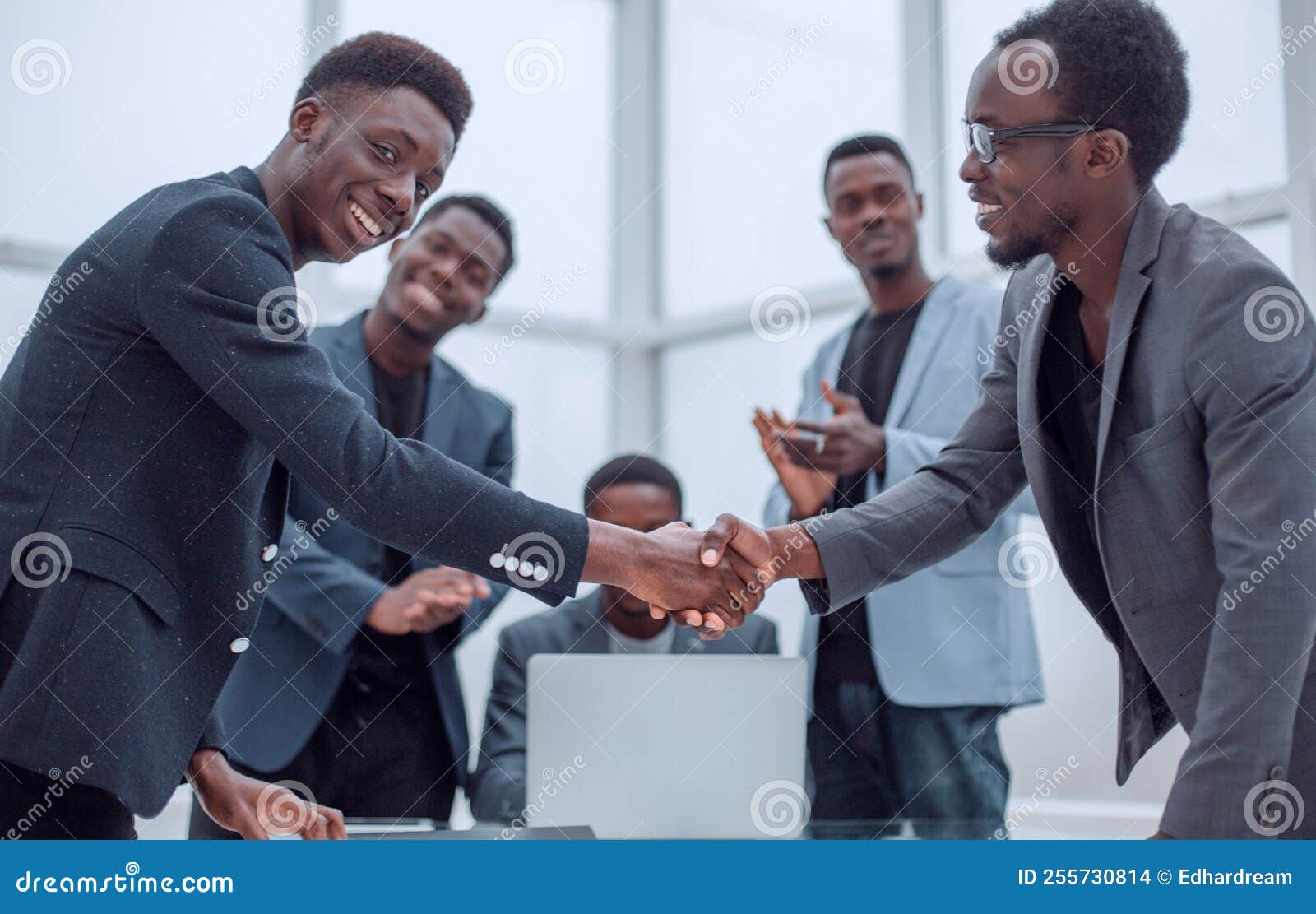 Reliable Handshake of Business Partners Over the Desktop. Stock Photo ...