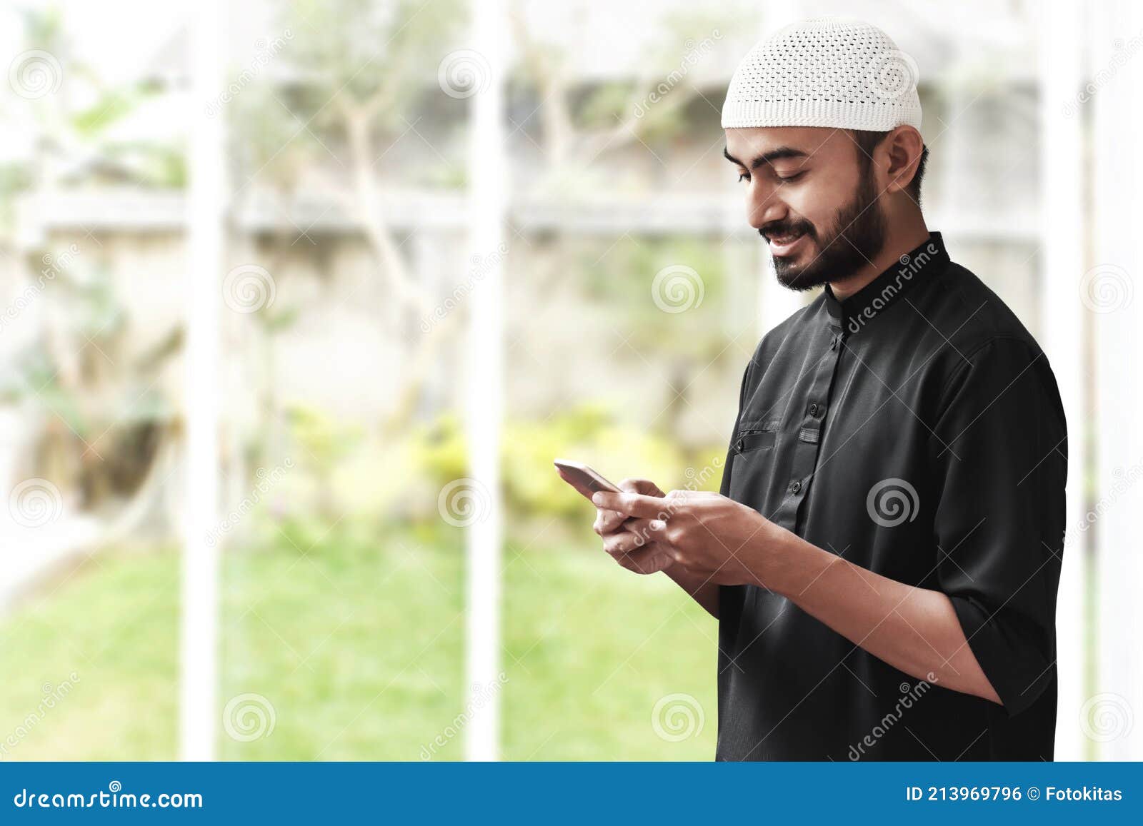 Religious Asian Muslim Men Use Handphone Stock Photo - Image of ...