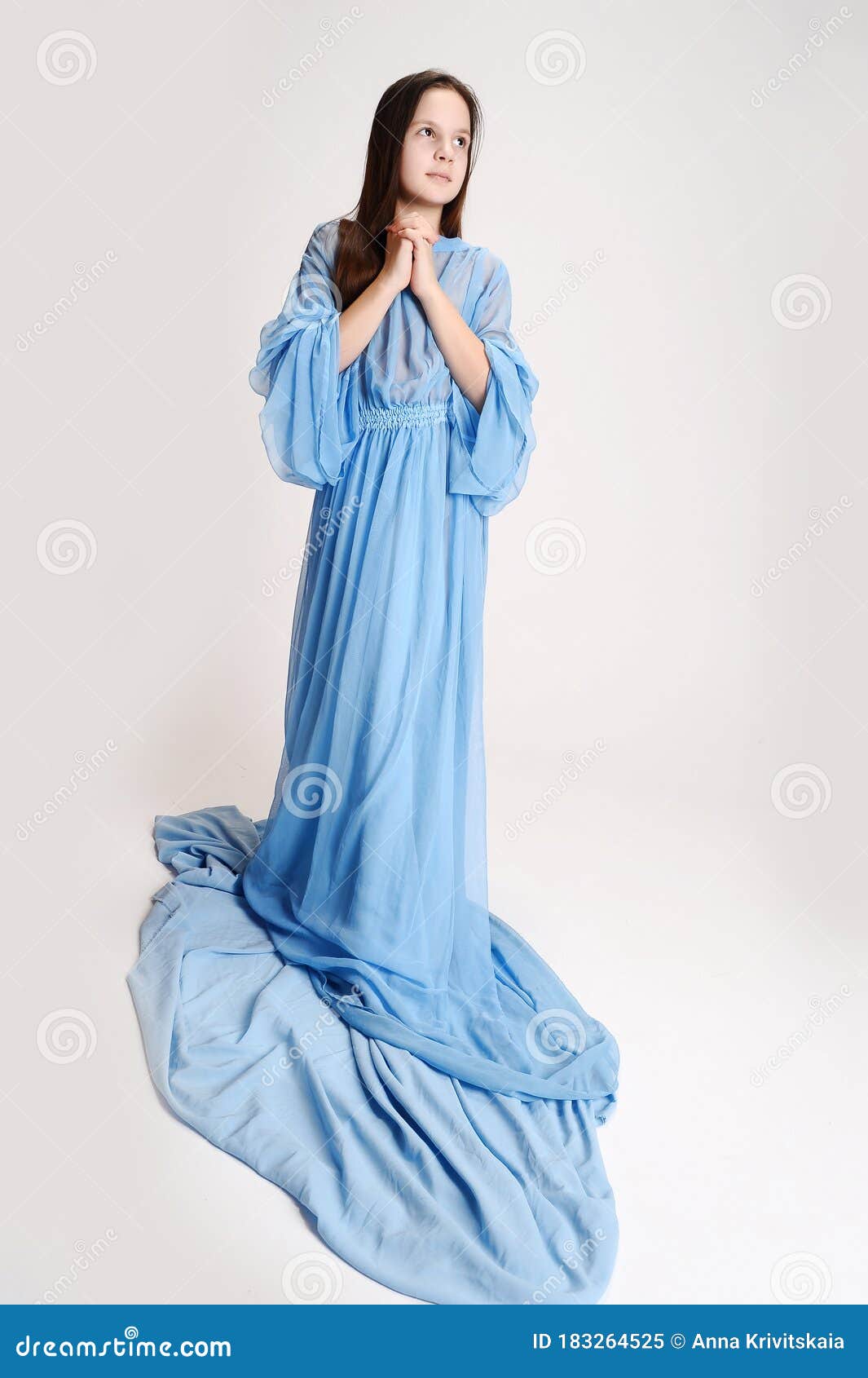 Religious Girl in a Blue Dress Stock Image - Image of belief, hope ...