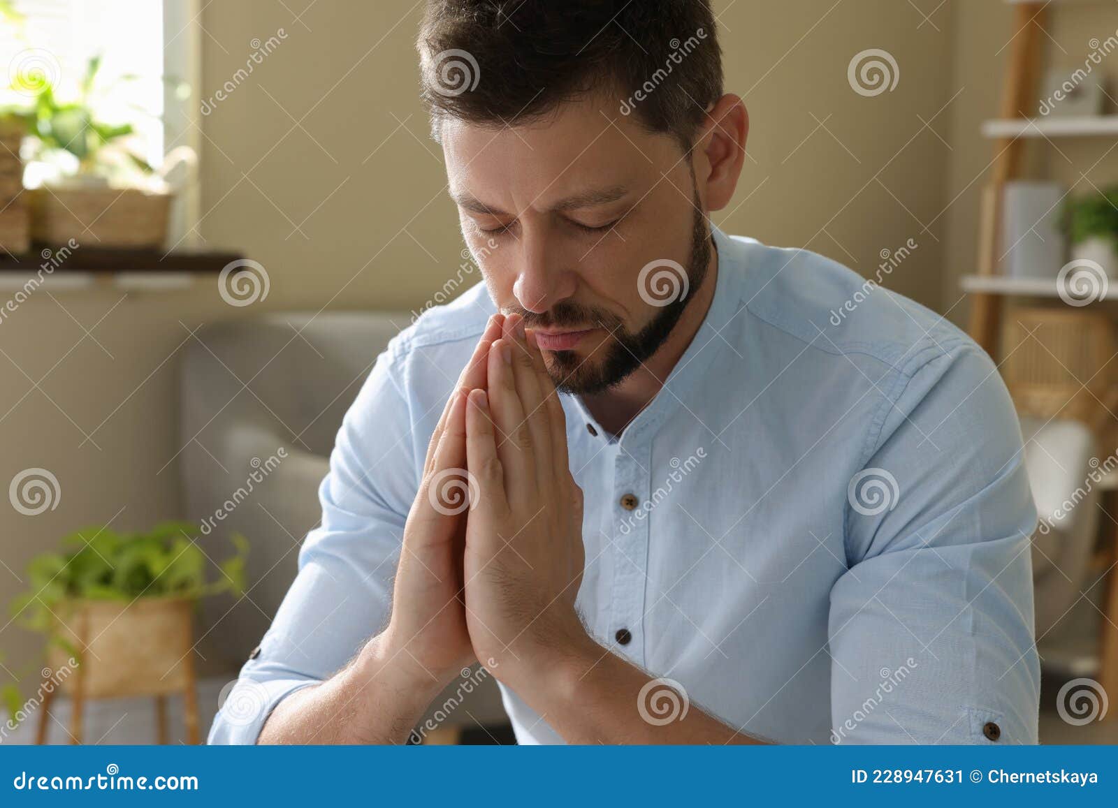 Religious Man with Clasped Hands Praying Indoors Stock Image - Image of ...