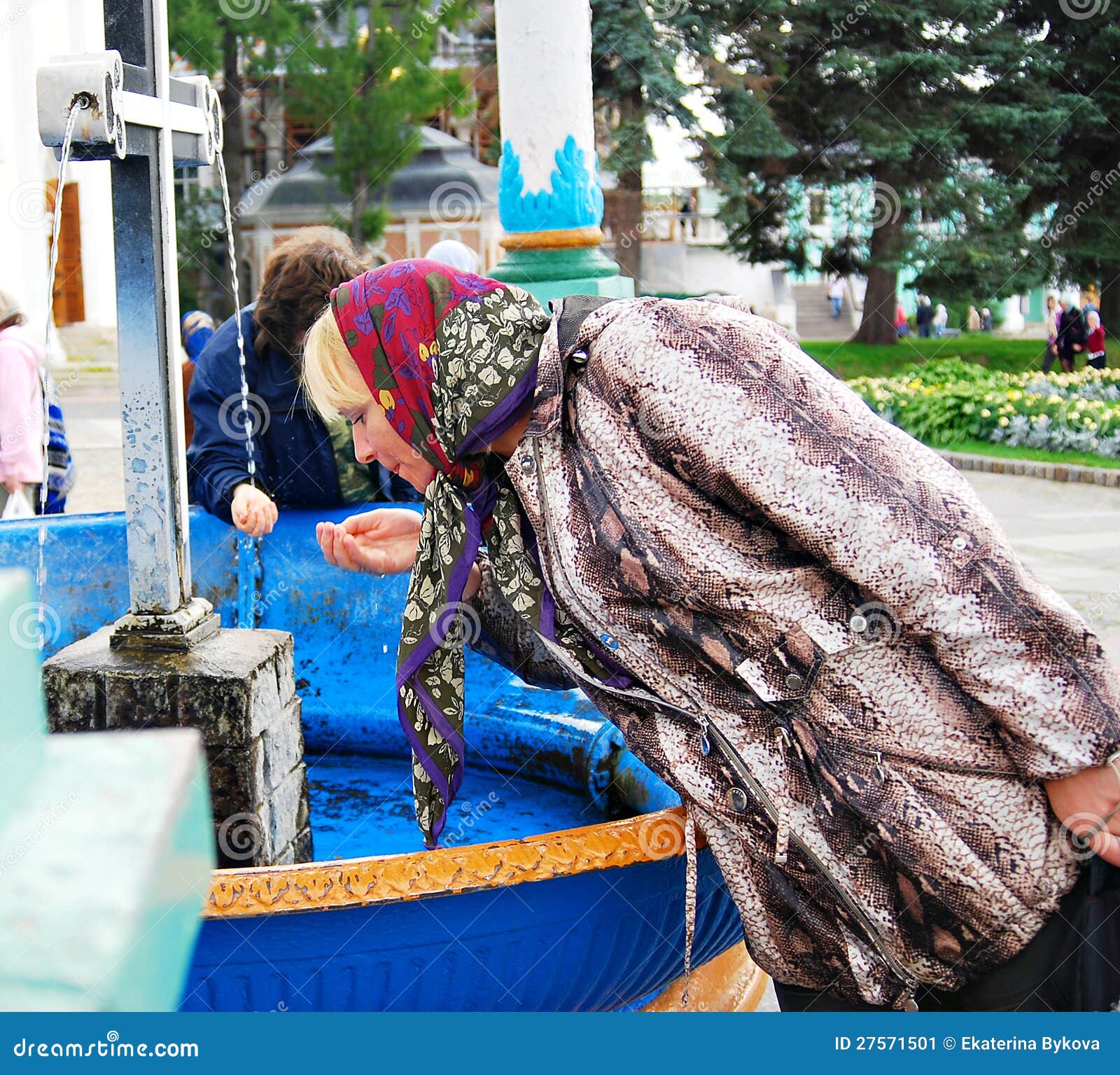 Religious Woman Drinking Water from Holy Spring Stock Image - Image of ...