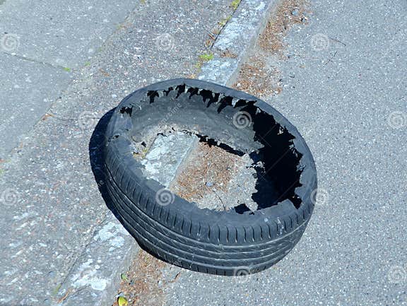 Remains of Exploded Tyre Seen at the Roadside Stock Photo - Image of ...