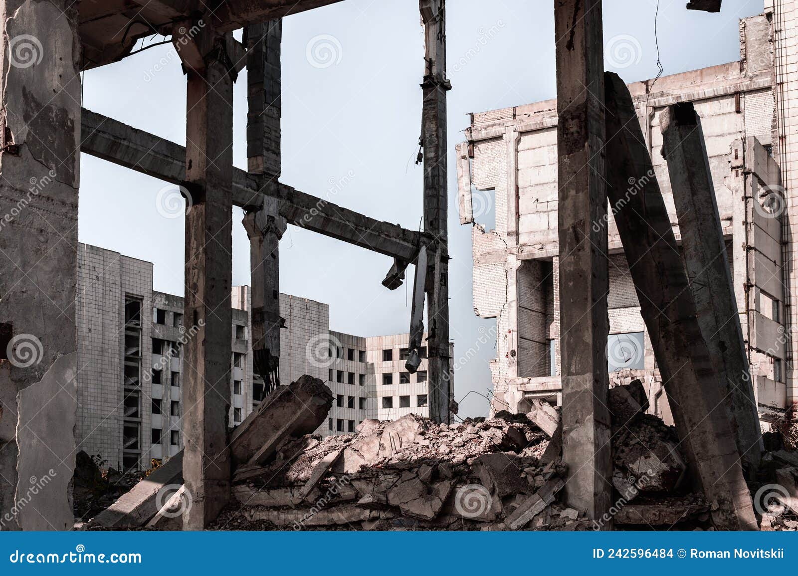The Remains of the Frame of the Structure with a Pile of Concrete ...