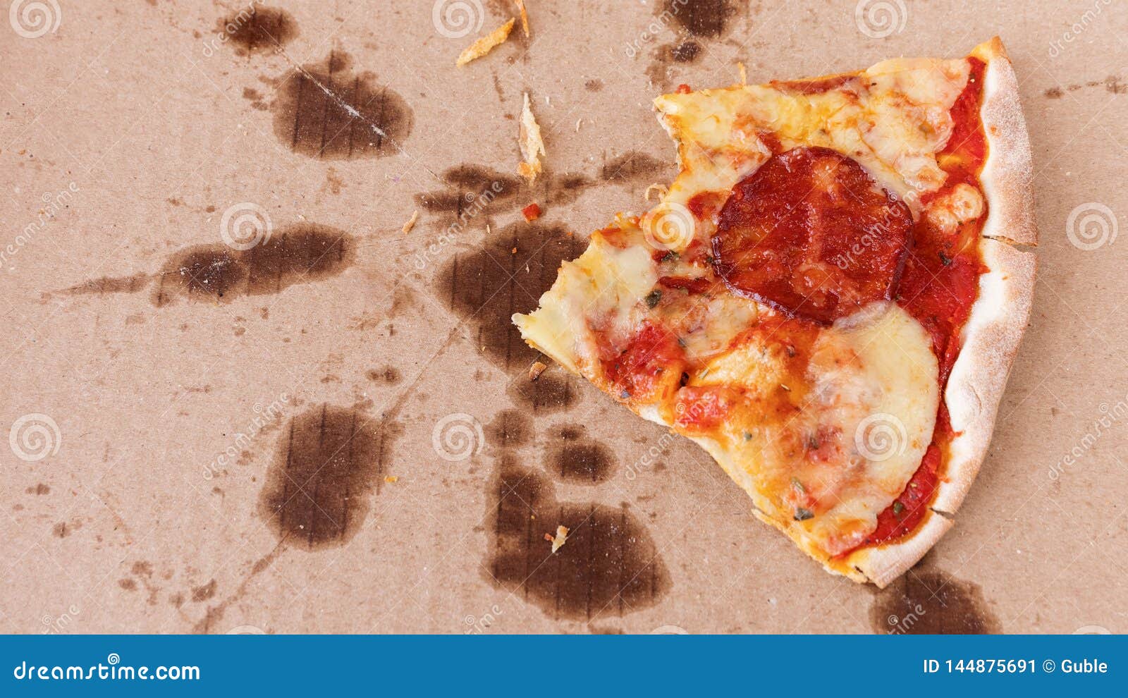 The Remains of Half-eaten Pizza on a Greasy Box Stock Image - Image of ...