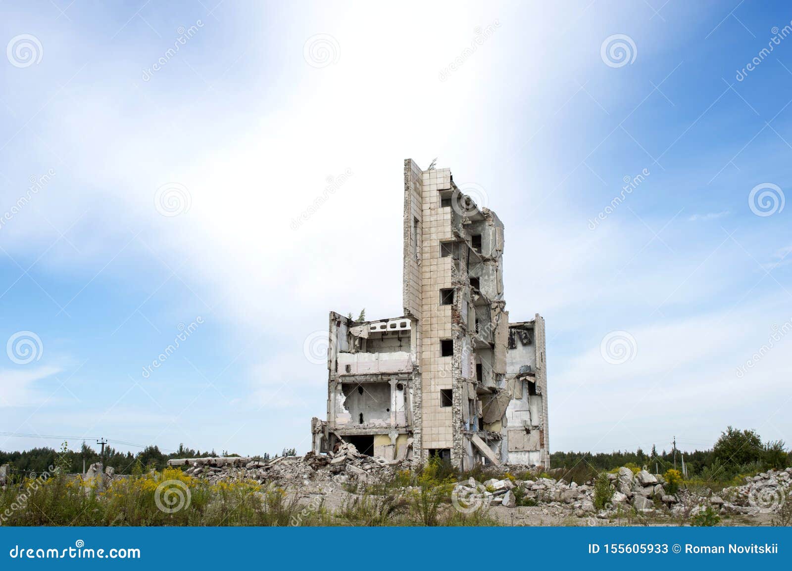 A Large Destroyed Building With A Pile Of Gray Concrete Fragments Of ...