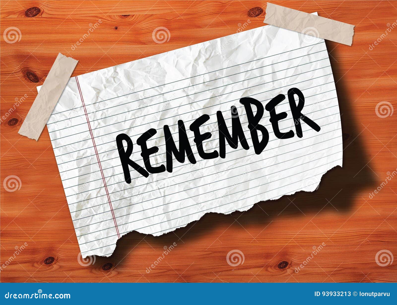 REMEMBER Handwritten on Torn Notebook Page Crumpled Paper on Wood ...