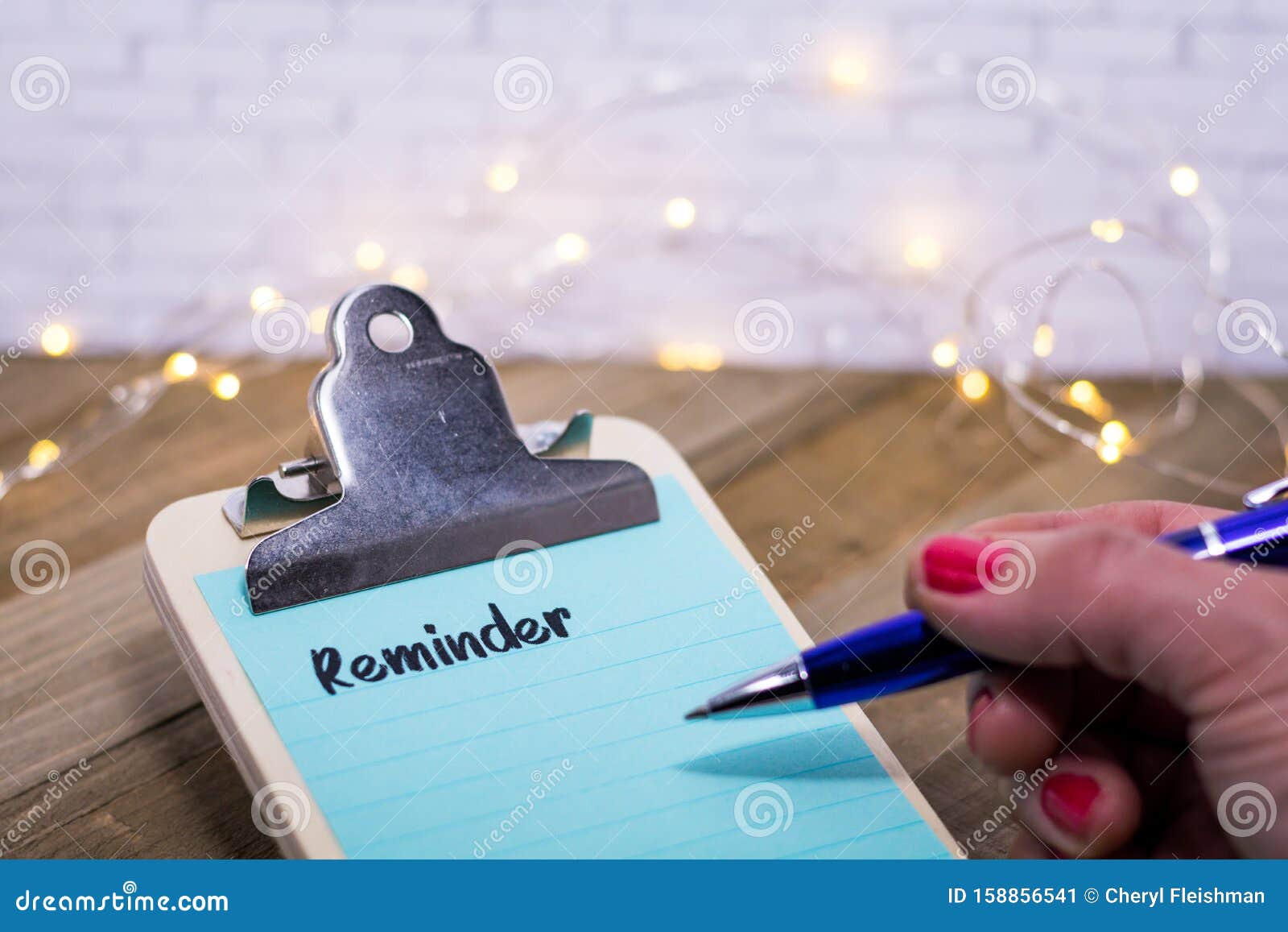 Reminder Concept with Words on Blue Lined Paper and Clipboard and Clock ...