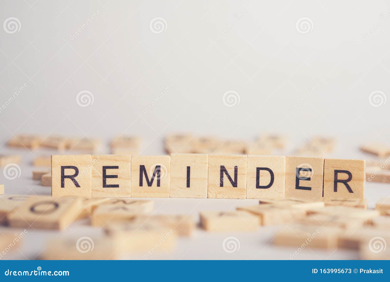REMINDER wooden tile font stock image. Image of text - 163995673