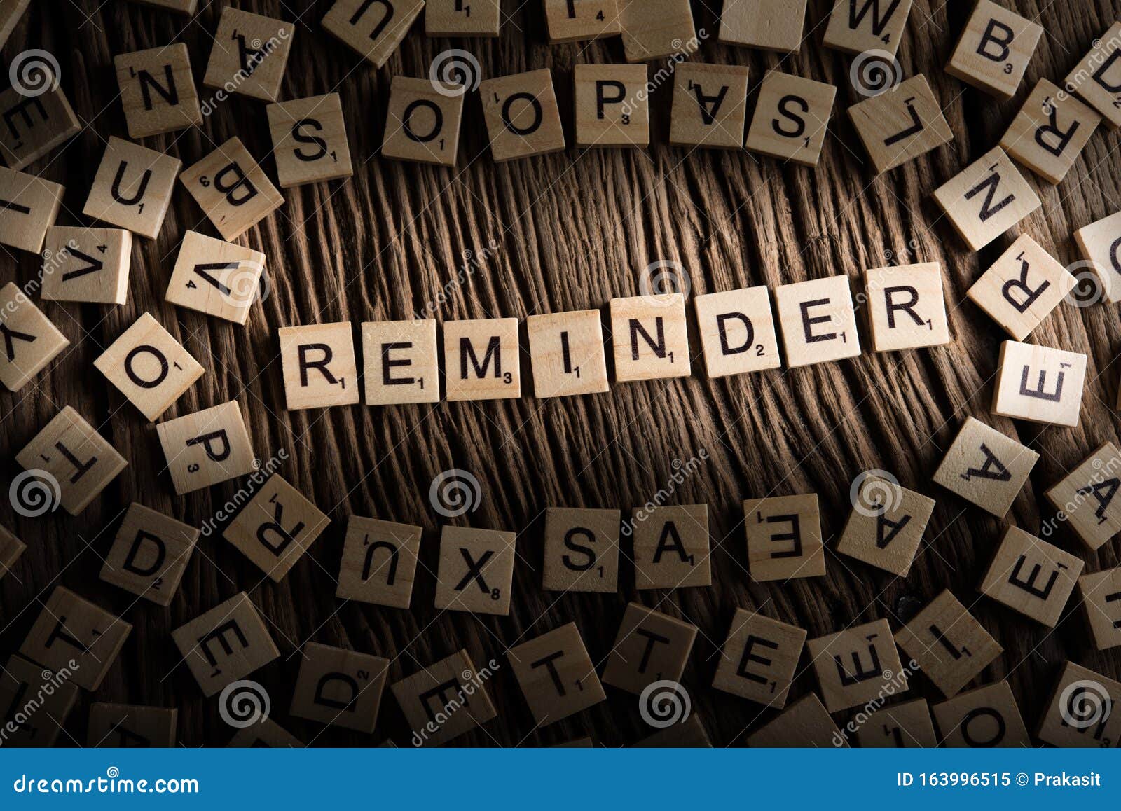 REMINDER wooden tile font stock image. Image of scrabble - 163996515
