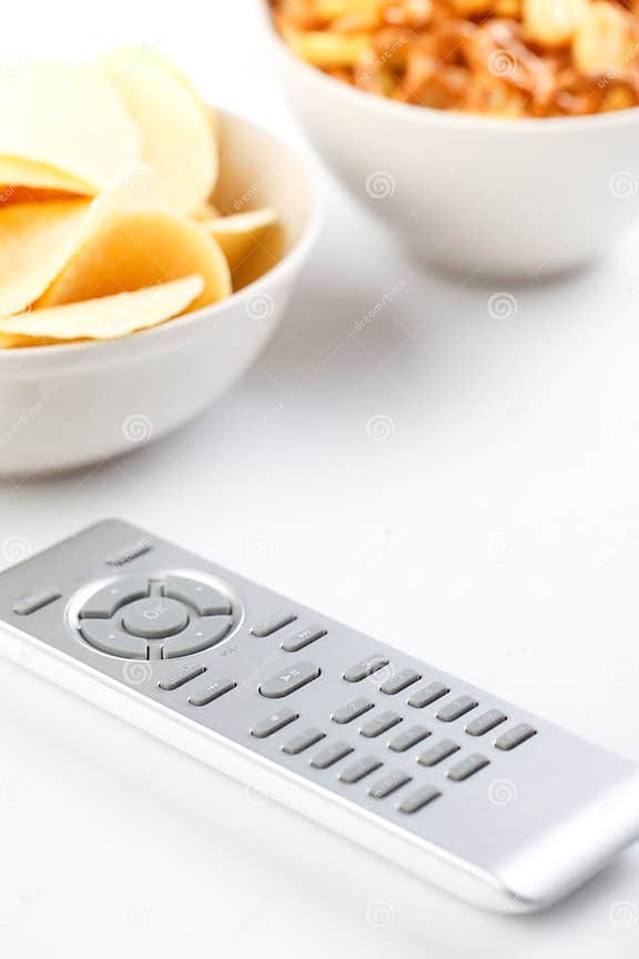 Remote control and chips stock photo. Image of prepared - 13449448
