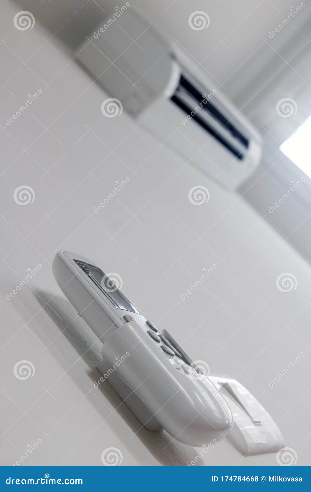 Remote Control Close Up with Air Conditioner Hang on White Wall. Stock ...