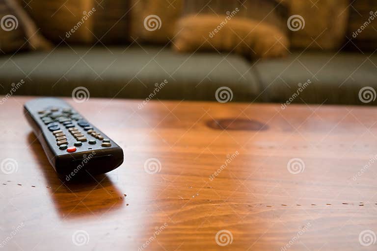 Remote Control and Coffee Table Stock Image - Image of keypad, table ...