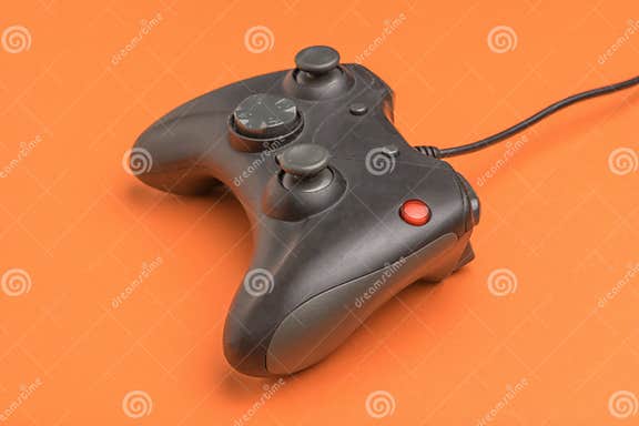 Remote Control for Computer Games on an Orange Background Stock Photo ...