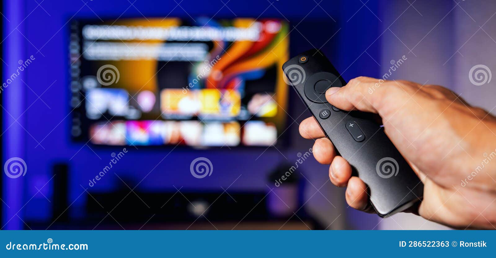 Remote Control in Hand with Tv in Background at Home. Streaming Service, Content on Demand Stock ...