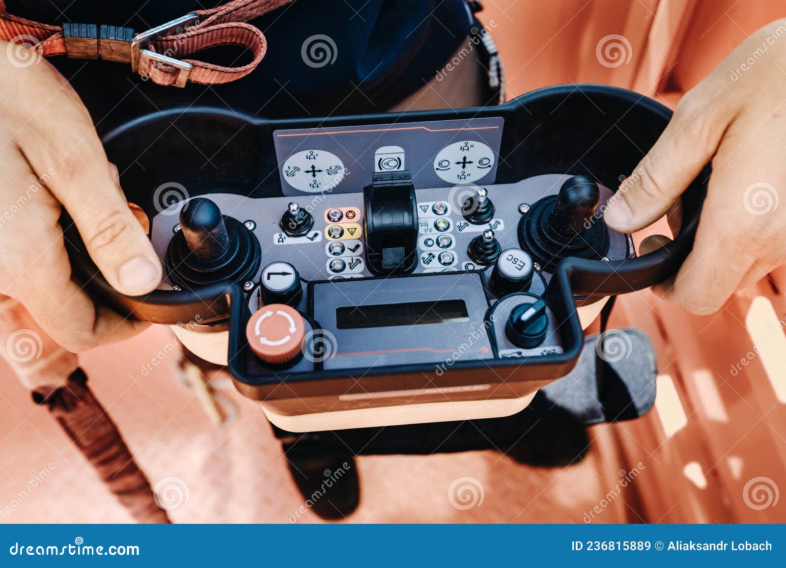Remote Control of a Lifting Car Crane in the Hands of a Person. a Panel ...