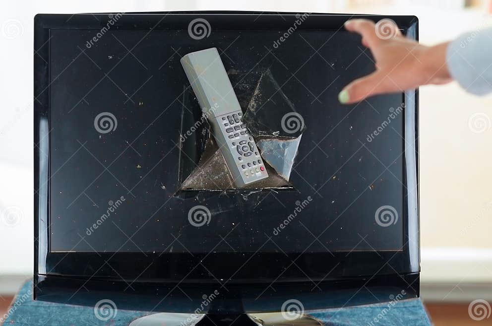 Remote Control Stuck Inside Broken Computer Screen Stock Image - Image ...