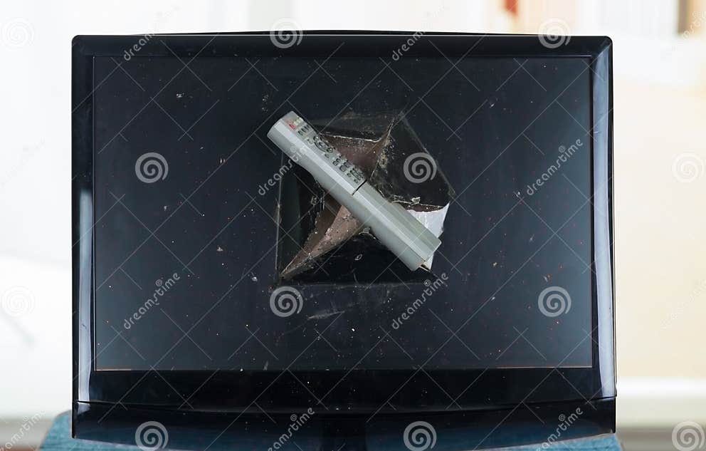 Remote Control Stuck Inside Broken Computer Screen Stock Image - Image ...