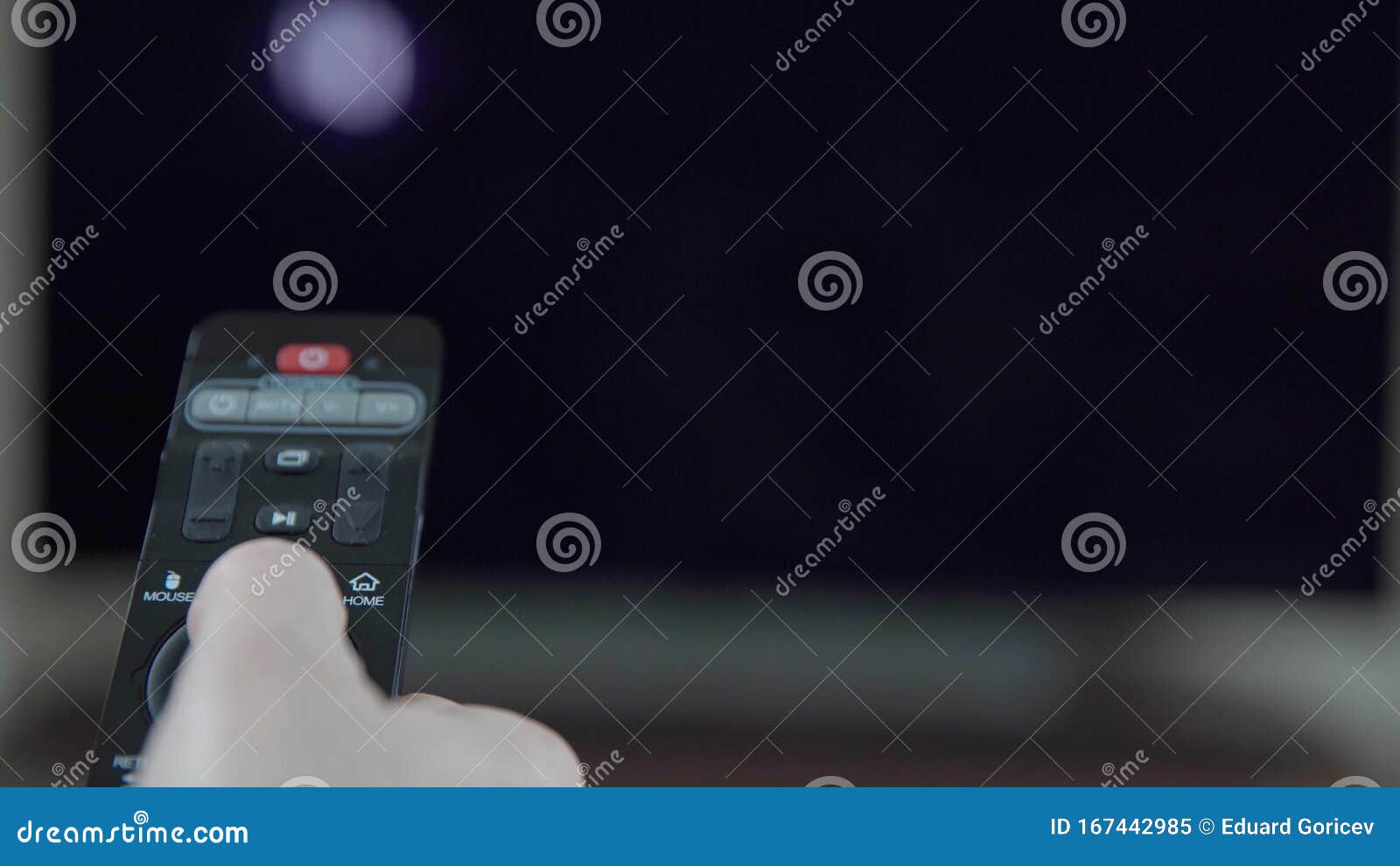 The Remote Control Switches the TV Channels and Controls the Volume ...