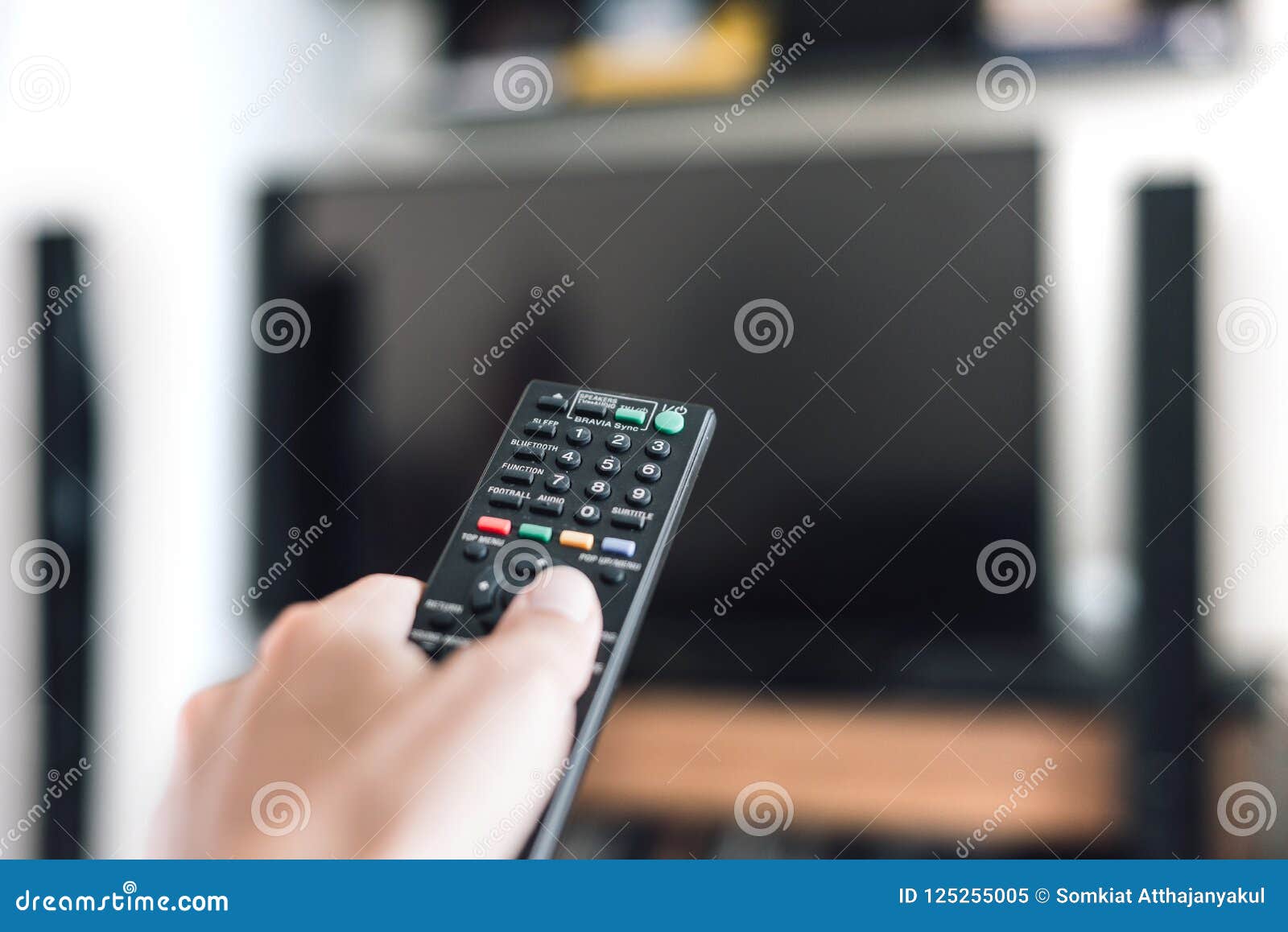 Remote Control with Television Background in a Living Room. Stock Image ...