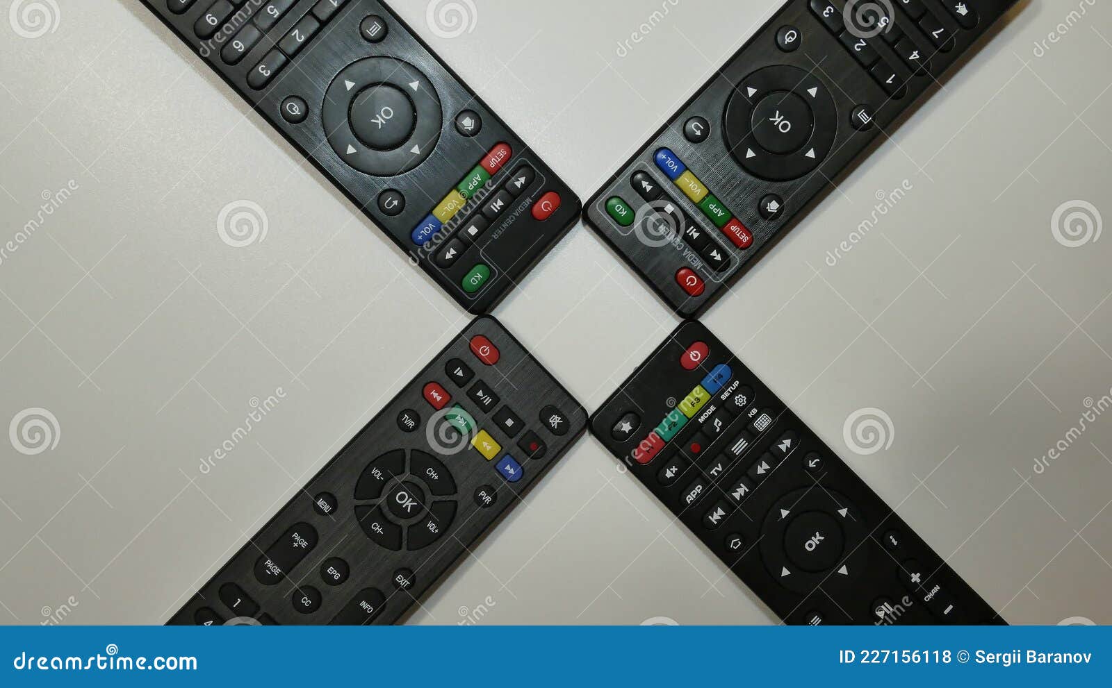 Remote Controls in a Shape of X Letter Close Up Stock Photo - Image of ...