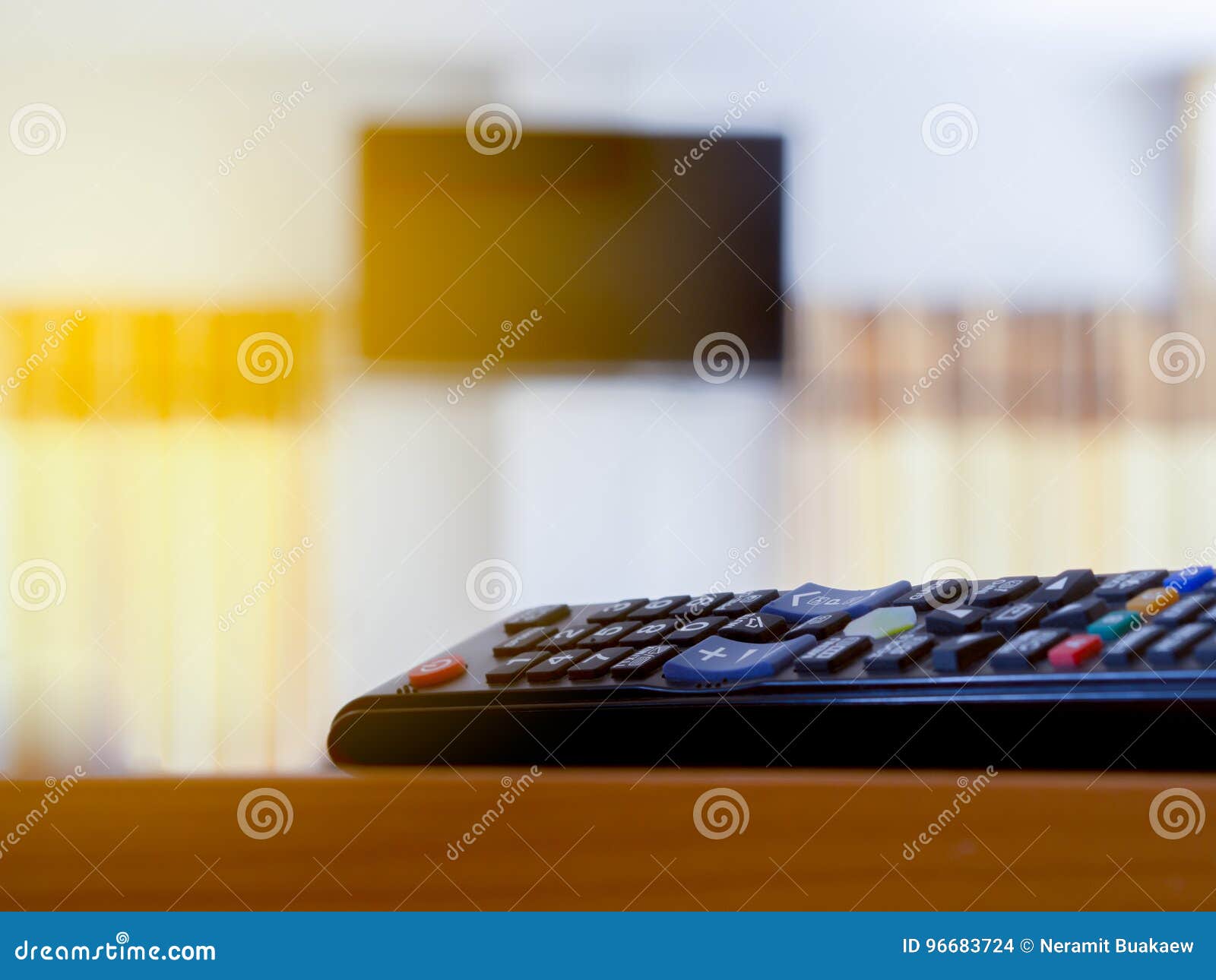 Remote Controls of TV on the Table at the Meeting Room. Flare Light ...
