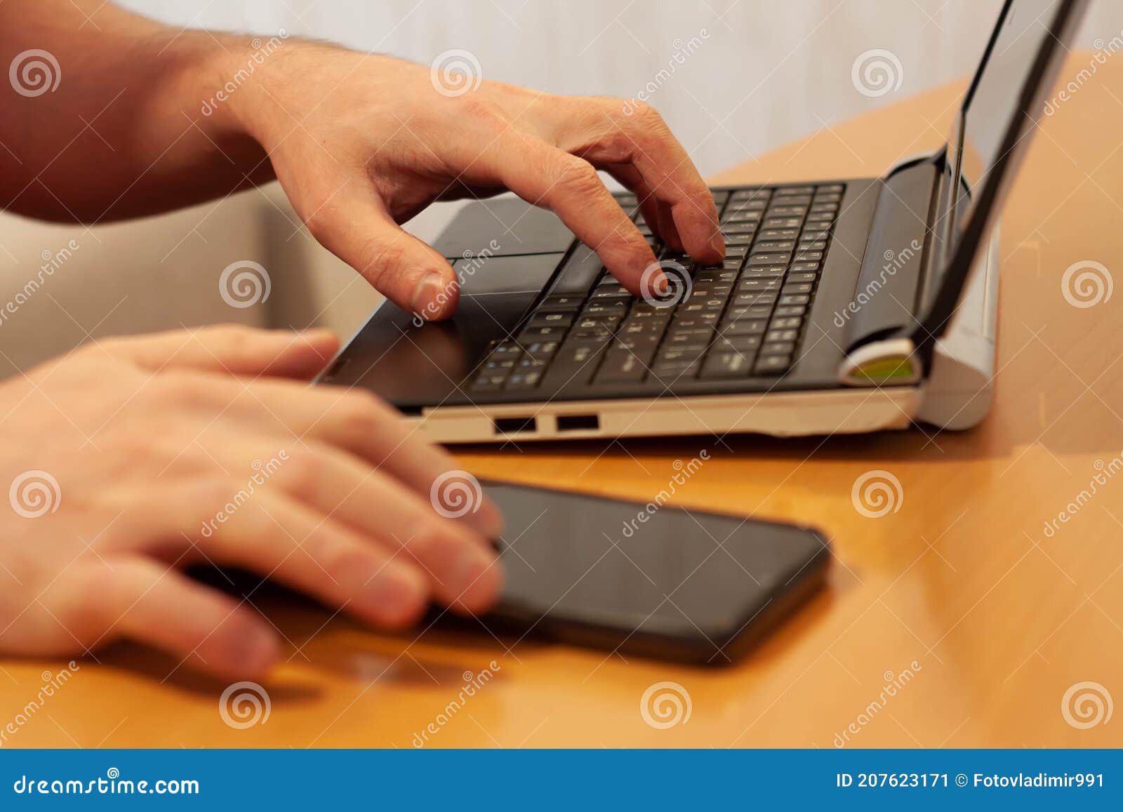 A Remote Employee Works at a Computer in a Pandemic and Self-isolation ...