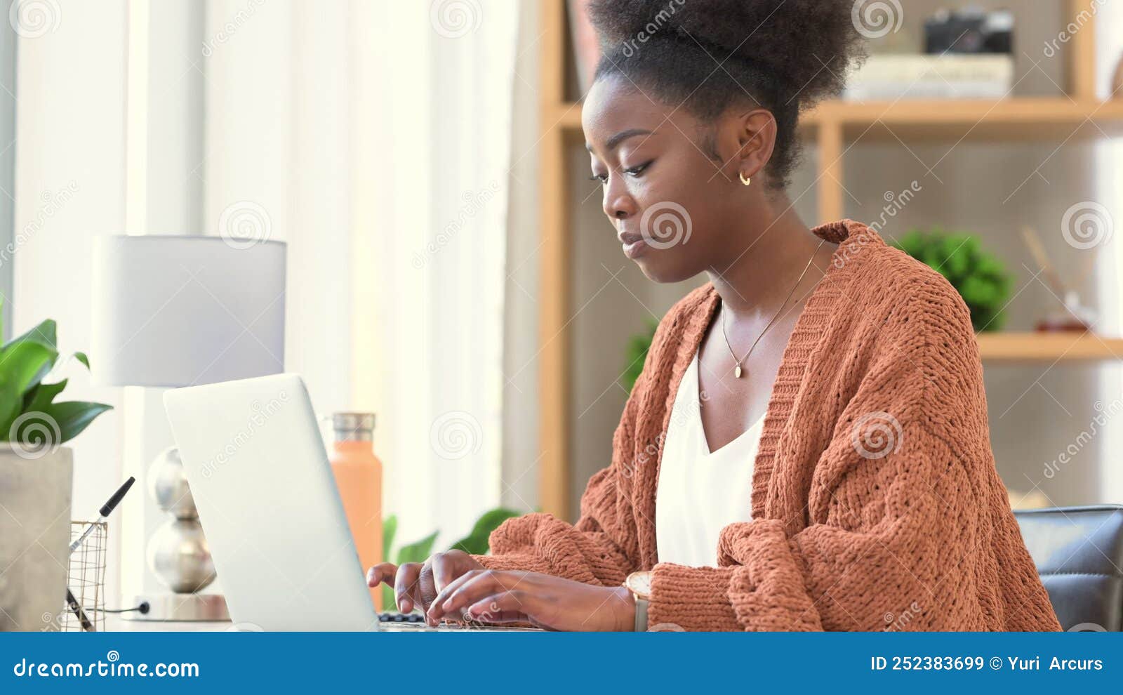 A Remote Student Typing and Doing Research for an Essay or Article on a ...