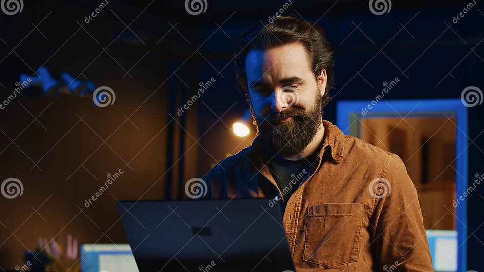 Remote it Support Worker Standing in Home Office, Programming on Laptop ...