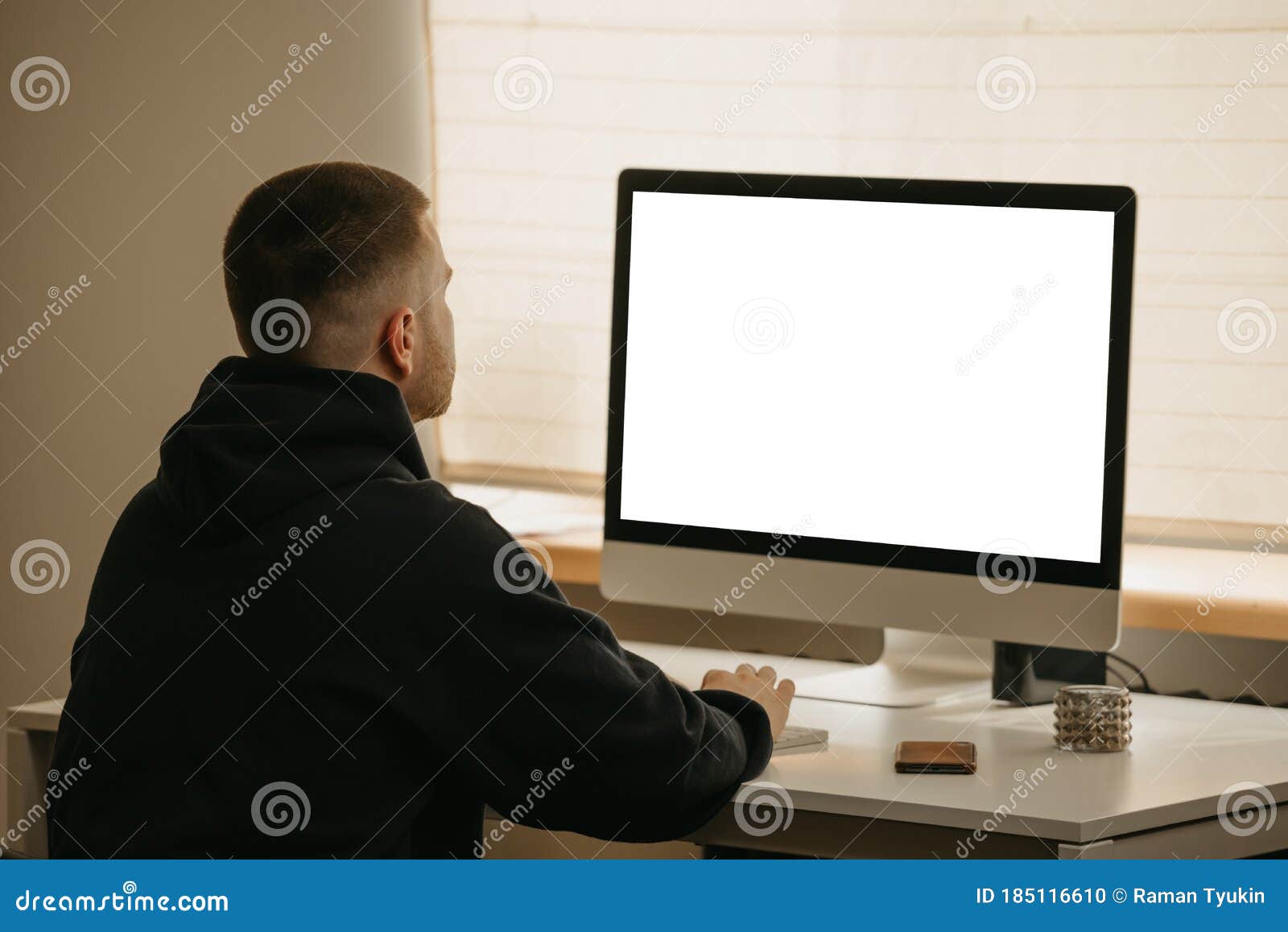 A Back View of a Businessman Works Remotely Using an All-in-one ...